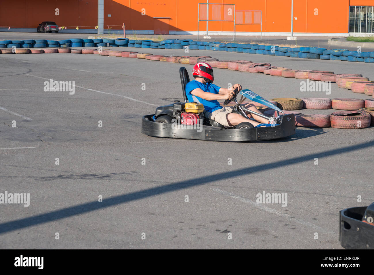Man driving fast a Kart in a circuit lap in Kharkiv Stock Photo - Alamy