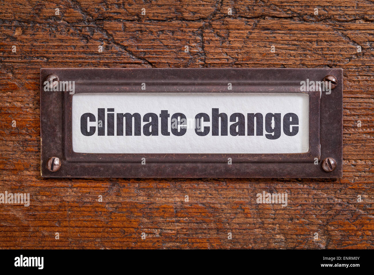climate change - file cabinet label, bronze holder against grunge and scratched wood Stock Photo ...