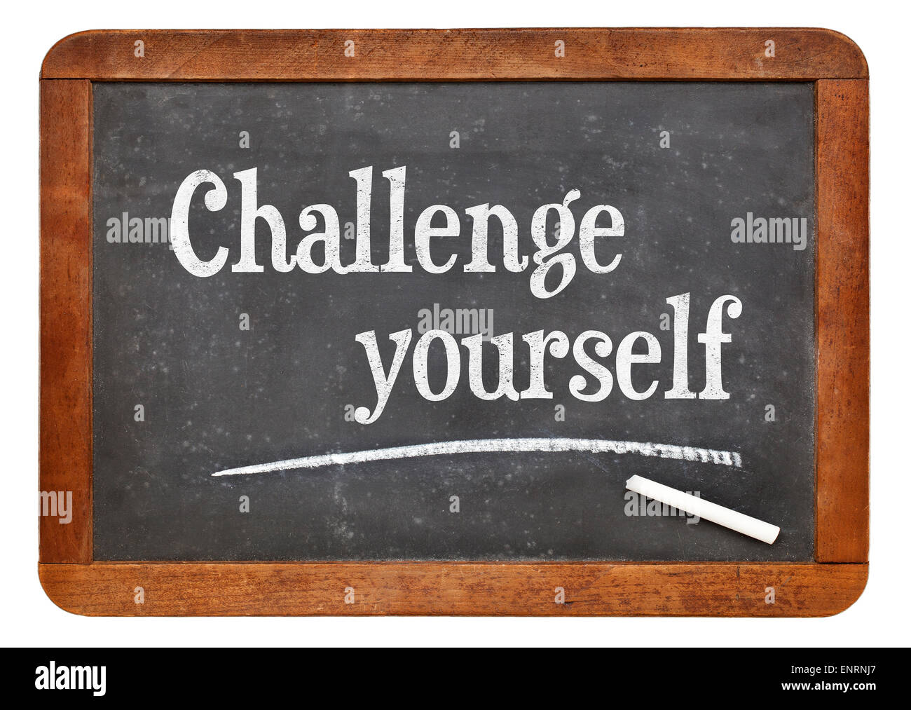 Challenge yourself - motivational text on a vintage slate blackboard ...