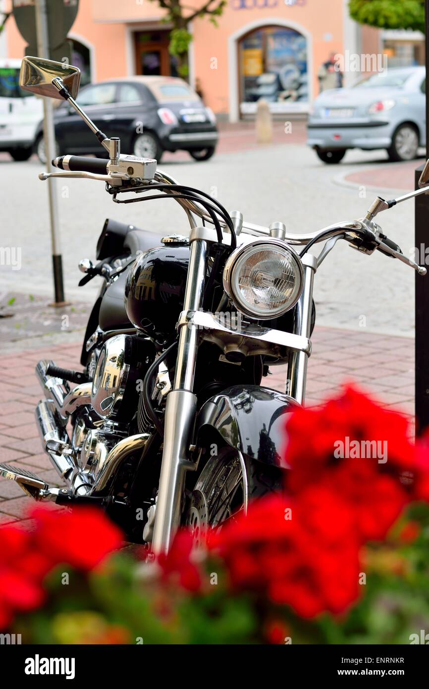 Vintage motorcycle with street background Stock Photo - Alamy