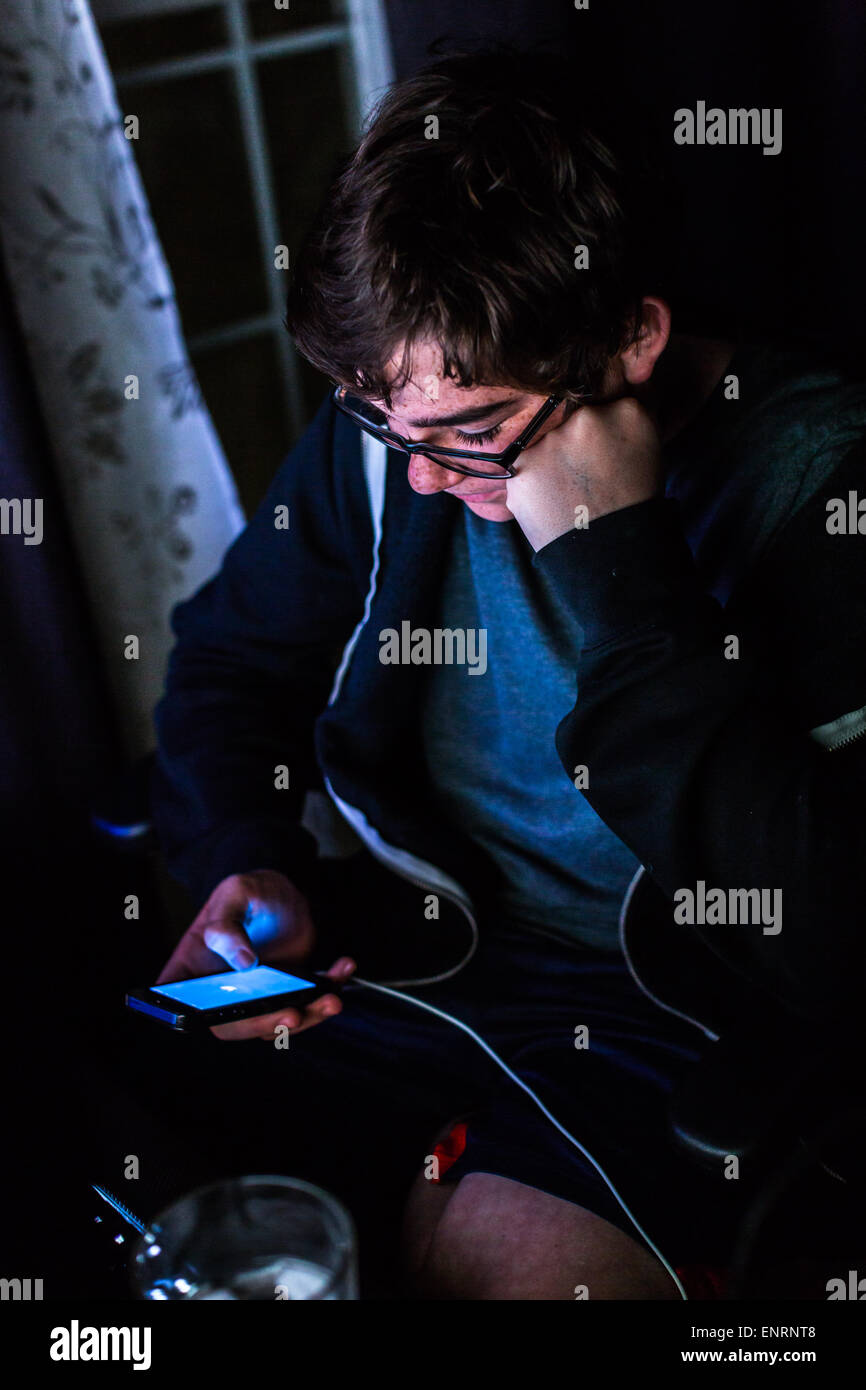 Teenager boy on computer in his room late at night Stock Photo - Alamy