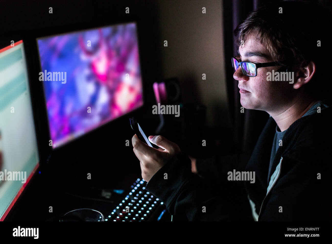 Teenager boy on computer in his room late at night Stock Photo - Alamy