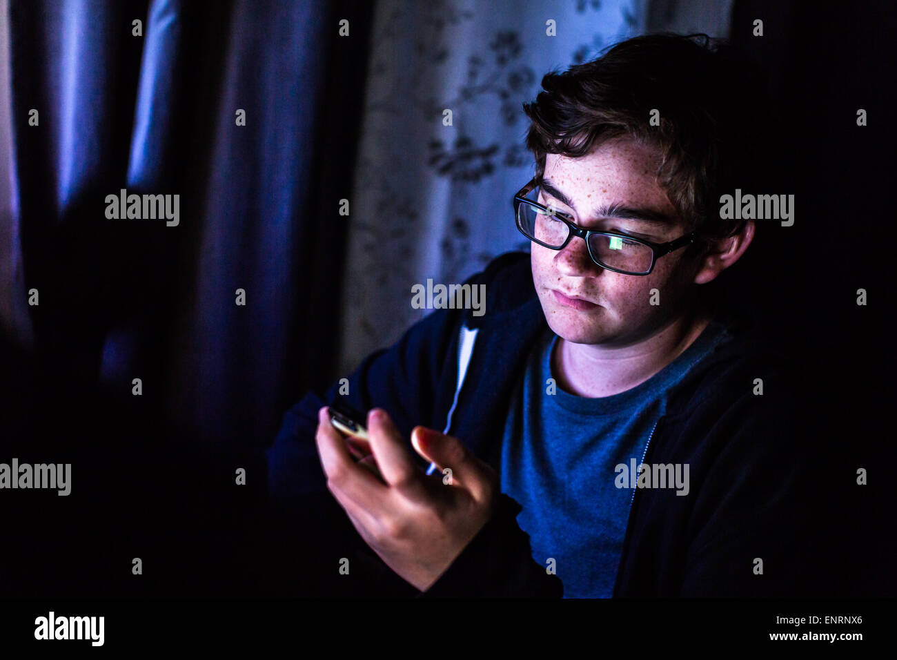 Teenager boy on computer in his room late at night Stock Photo - Alamy