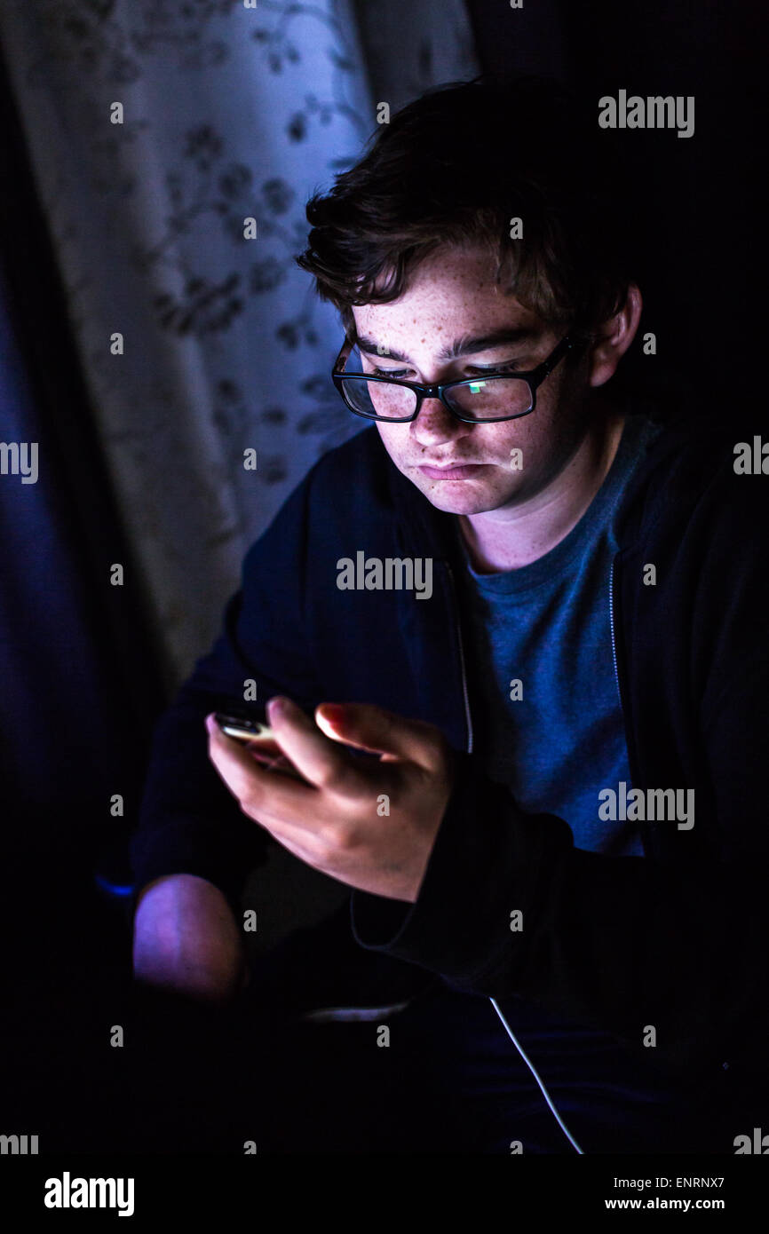 Teenager boy on computer in his room late at night Stock Photo - Alamy