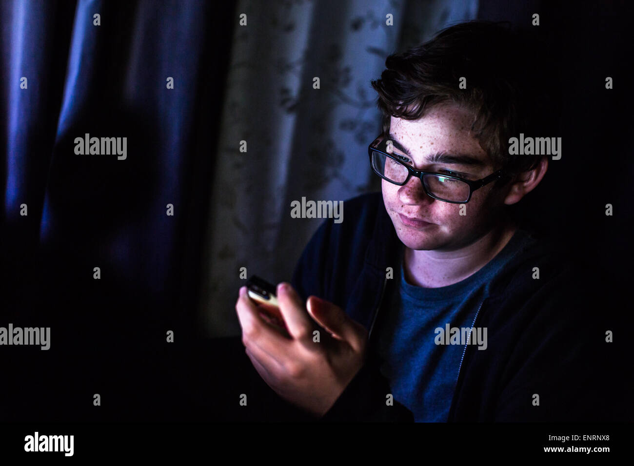 Teenager boy on computer in his room late at night Stock Photo - Alamy