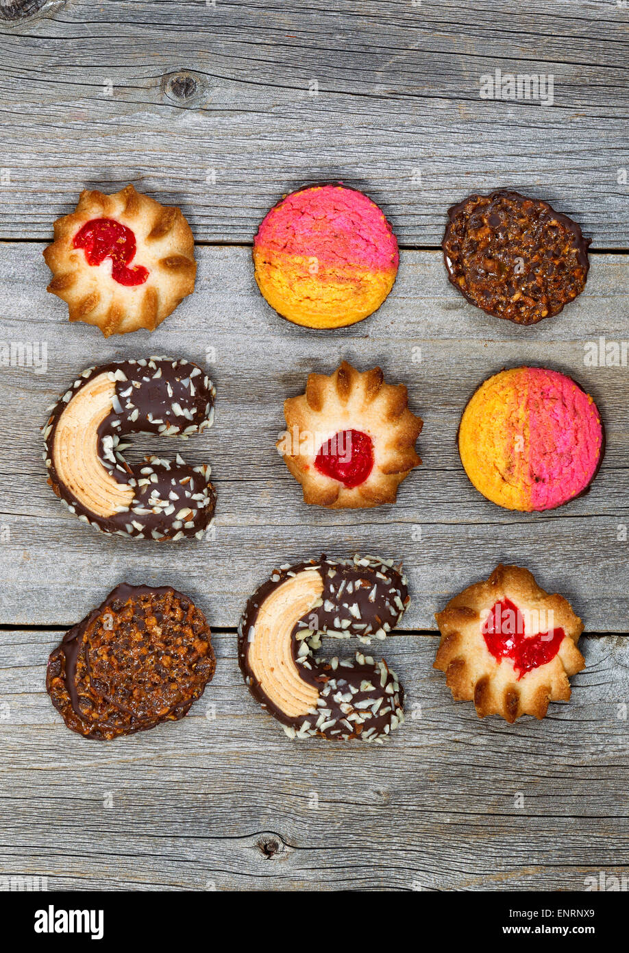 Top view angled shot of assorted cookies resting on rustic wood. Layout ...