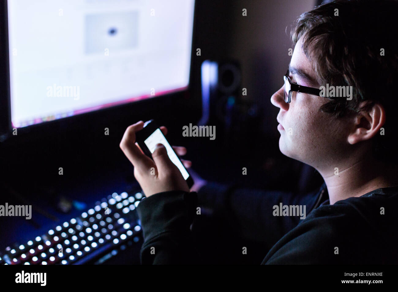 Teenager boy on computer in his room late at night Stock Photo - Alamy