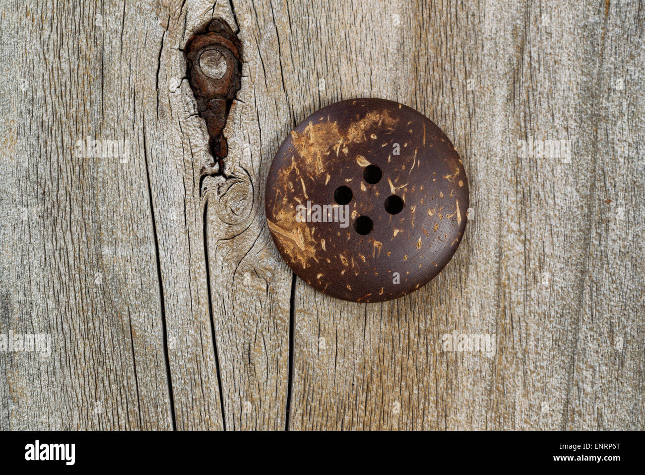 Close up of an old large clothing button on rustic wood Stock Photo - Alamy