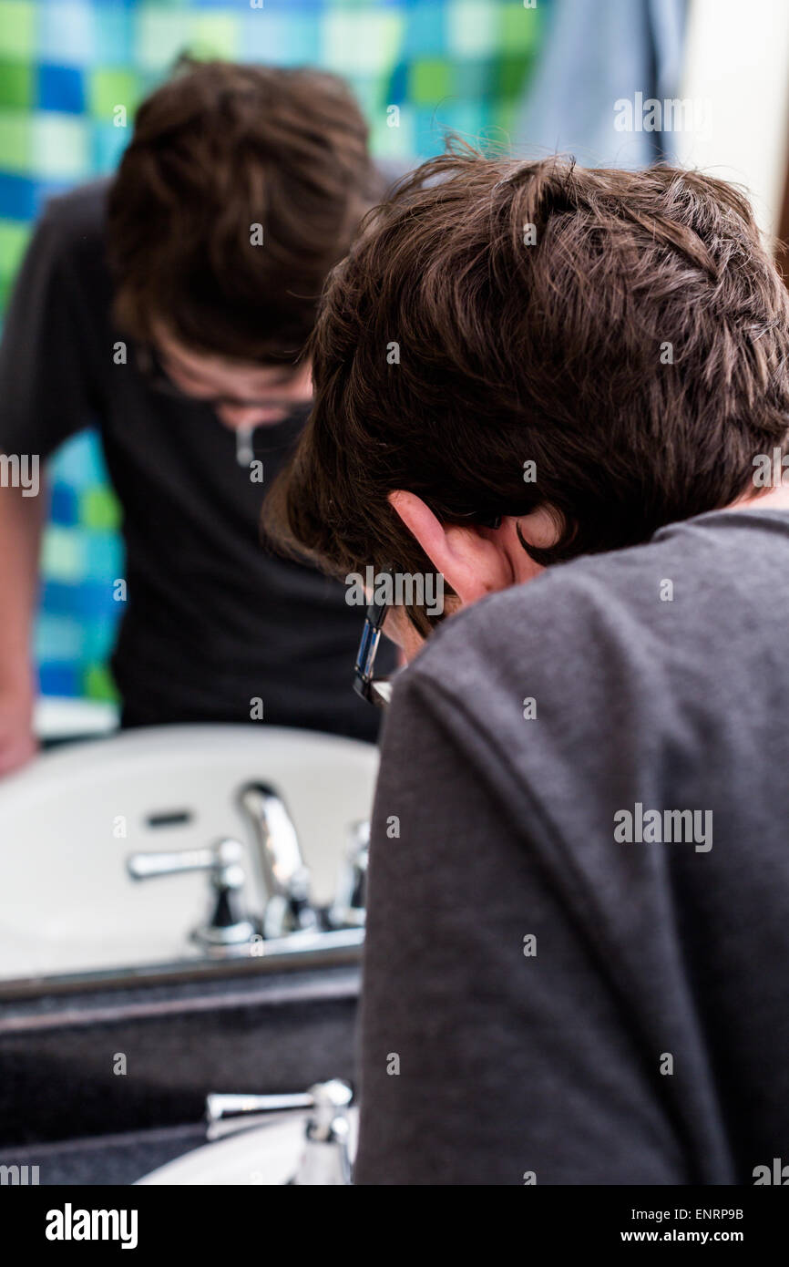 Teenage boy getting ready for school in the morning Stock Photo - Alamy