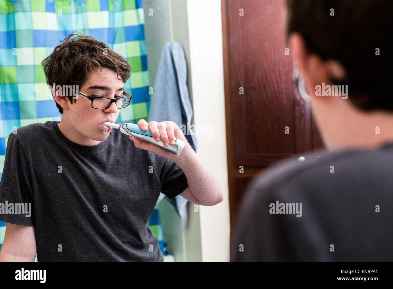 Teenage boy getting ready for school in the morning Stock Photo - Alamy