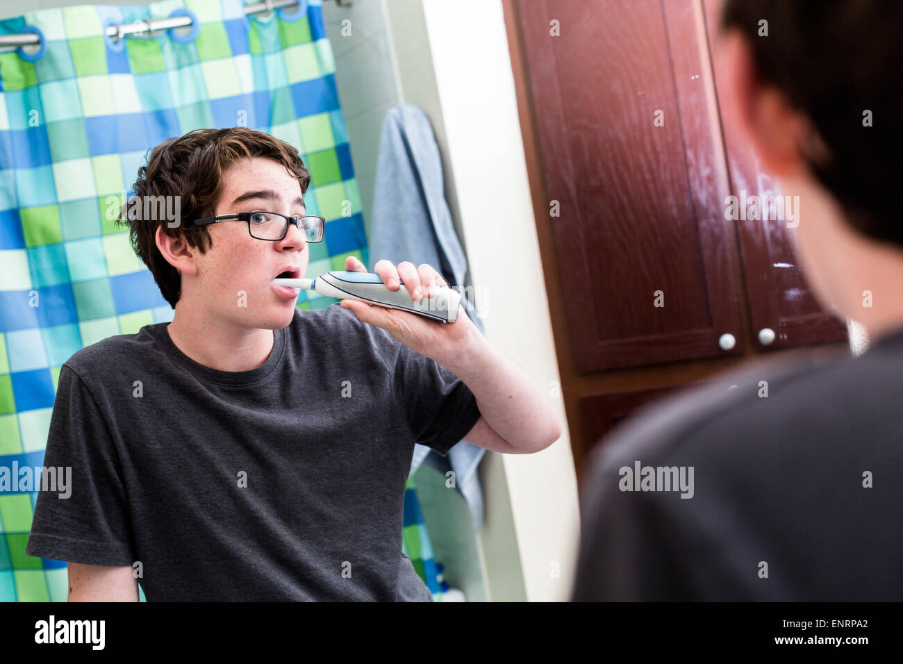 Teenage boy getting ready for school in the morning Stock Photo - Alamy