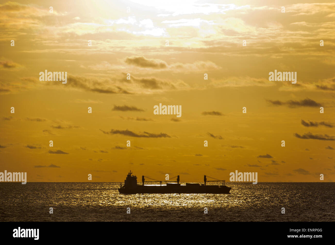 Cargo vessel under the light of the sunset in the Atlantic ocean Stock ...