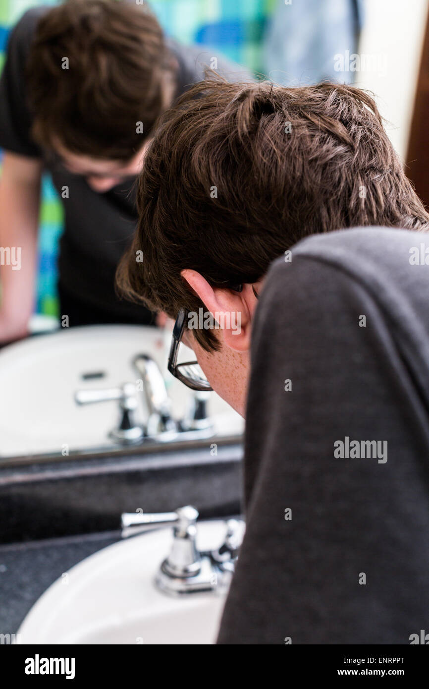 Teenage boy getting ready for school in the morning Stock Photo - Alamy