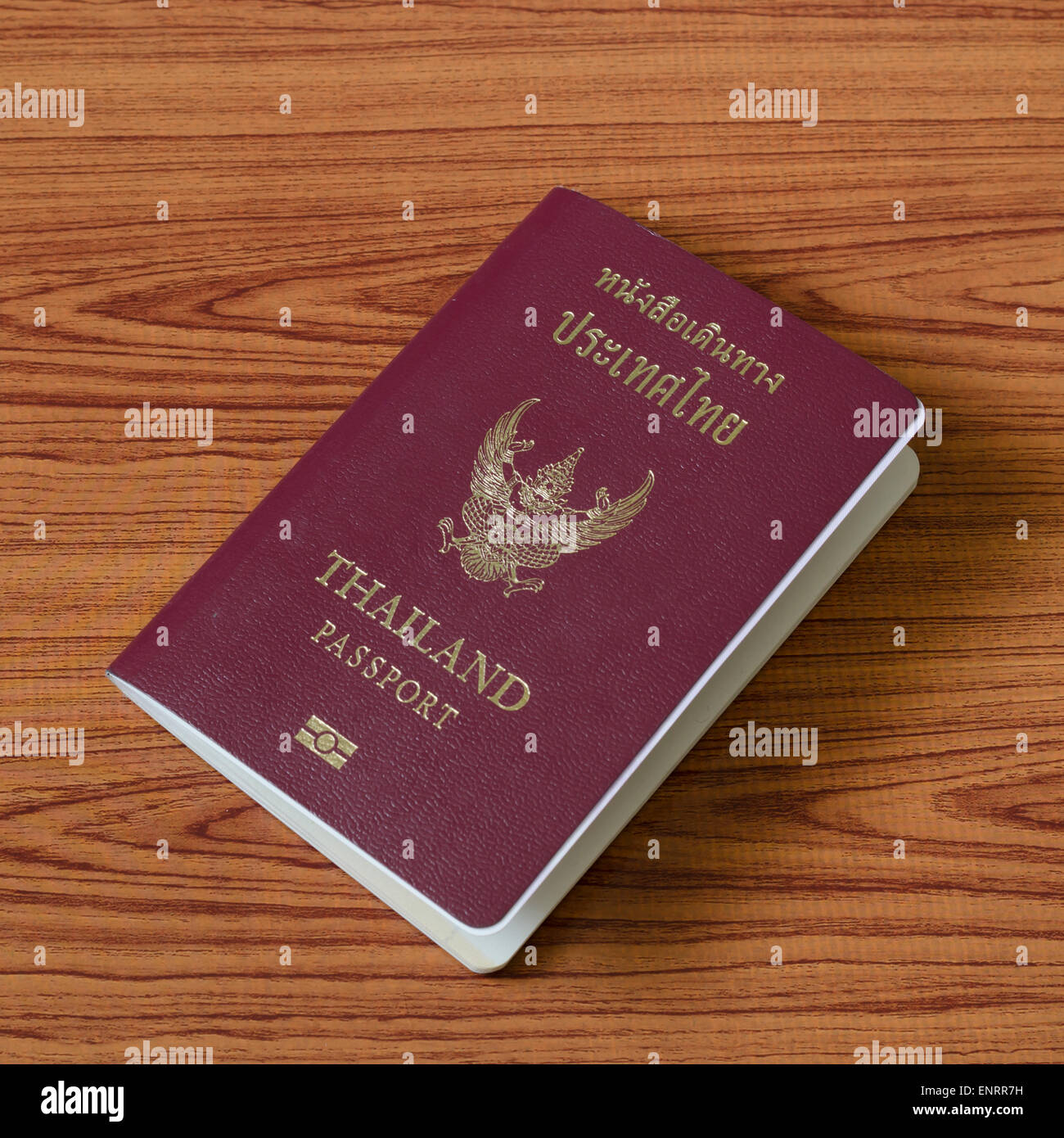 Thai passport on wood table background Stock Photo - Alamy