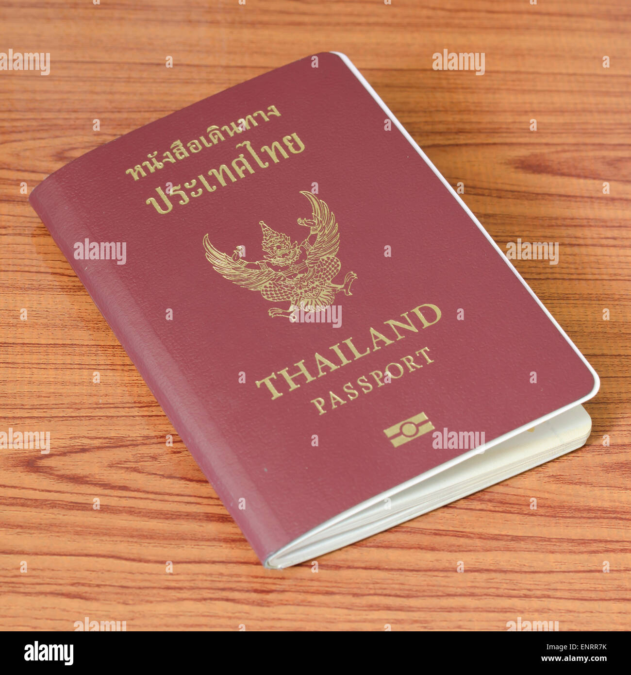 Thai passport on wood table background Stock Photo - Alamy