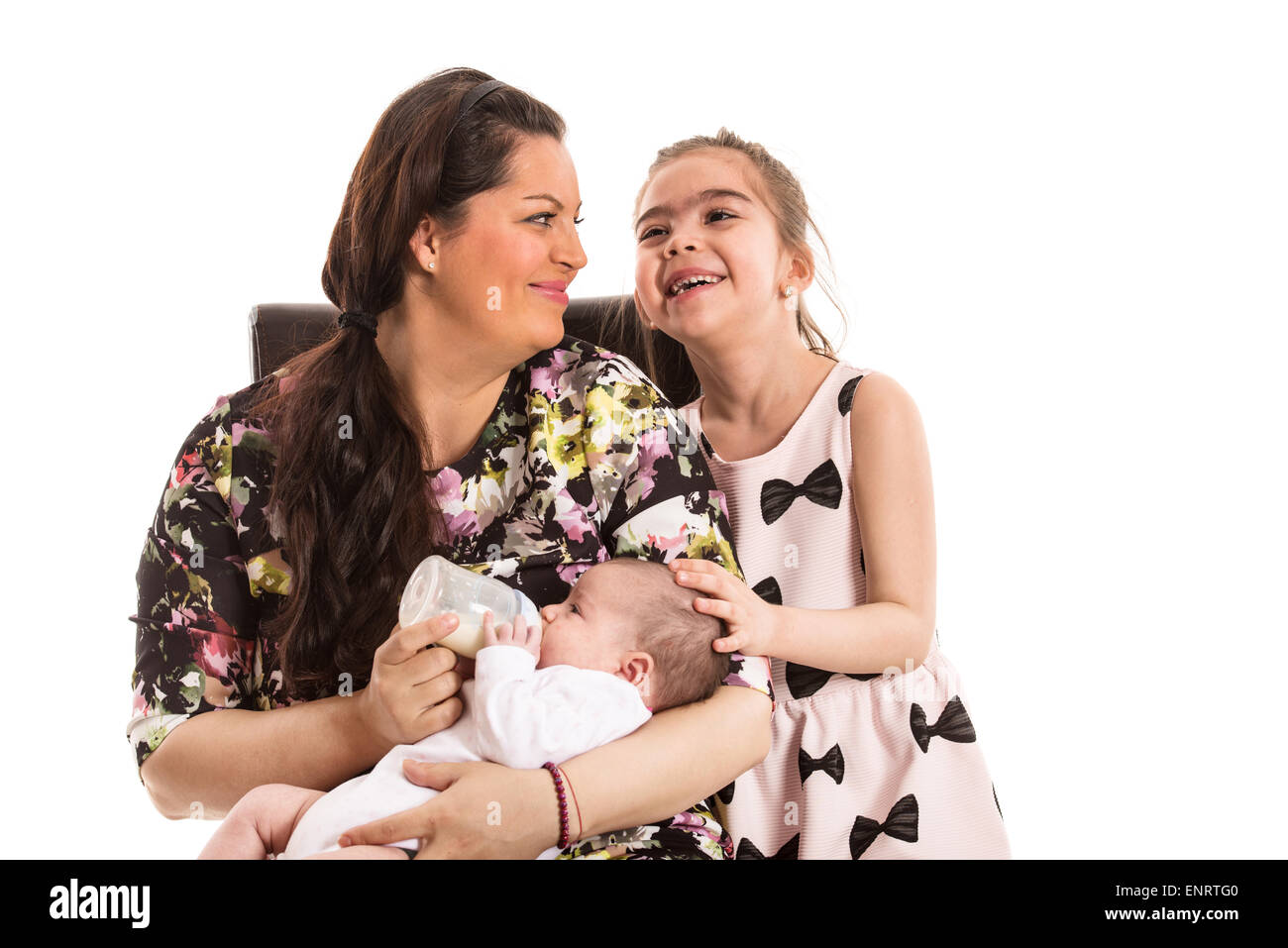 Mother feed newborn baby girl and having conversation with preschool ...