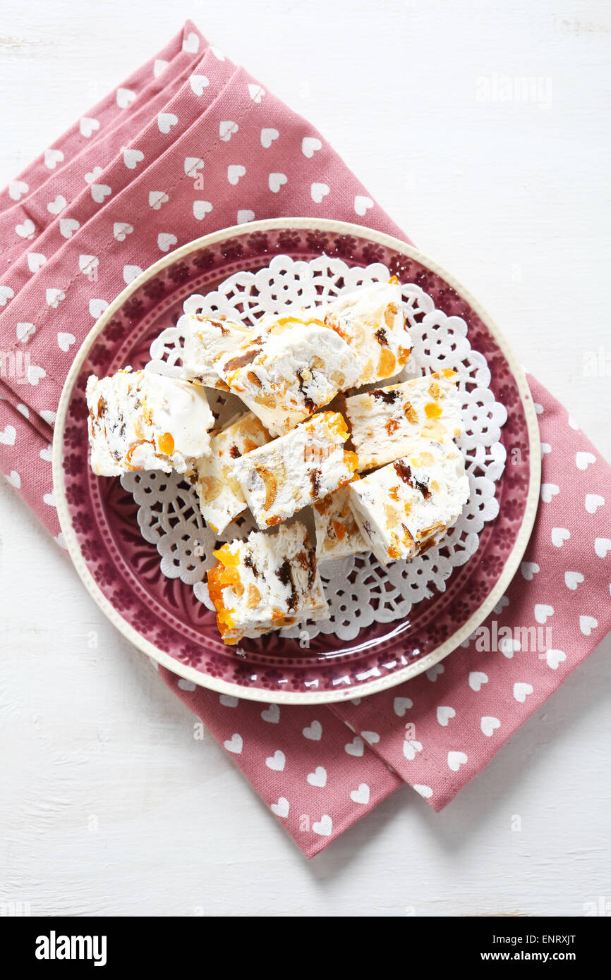 East sweets on a plate over white background, food Stock Photo - Alamy