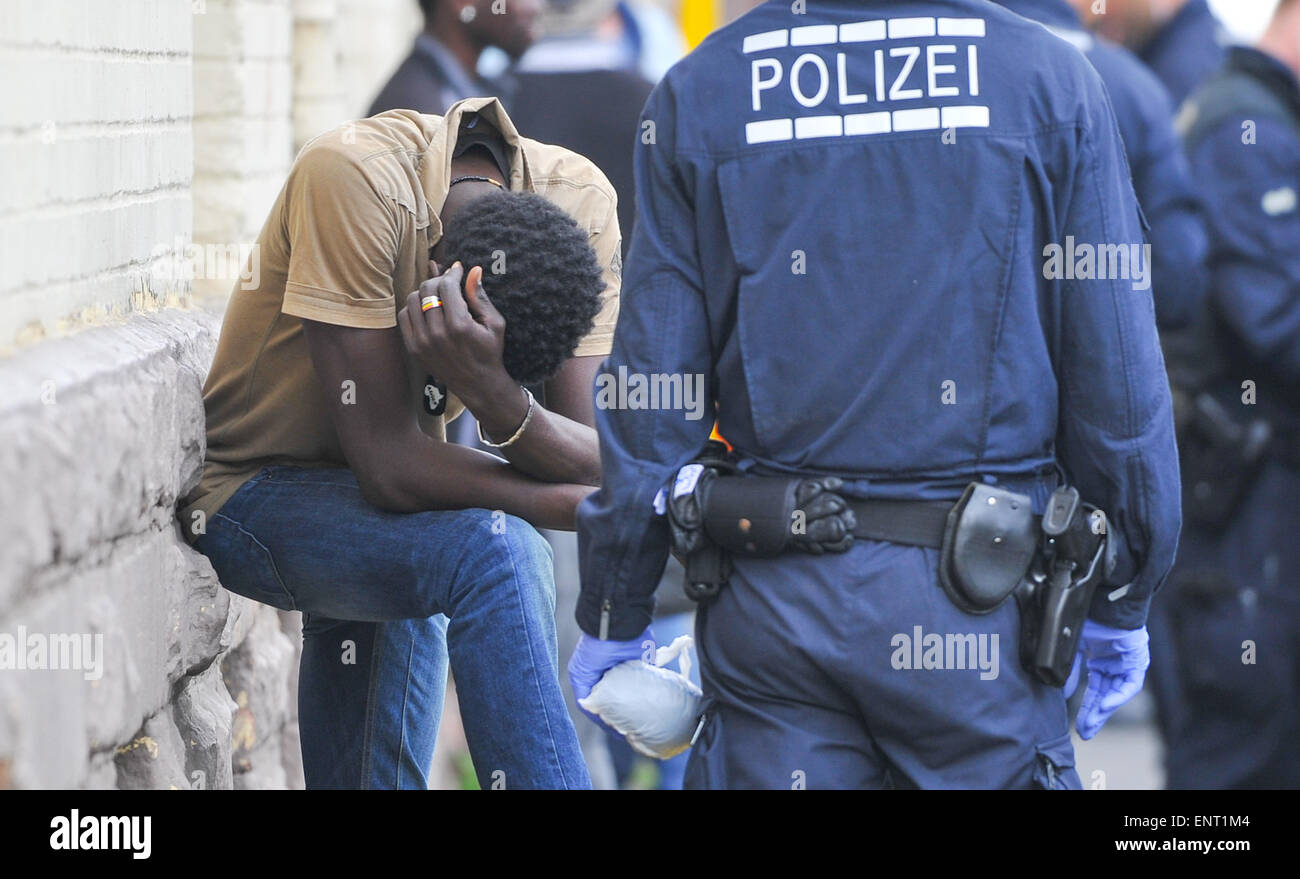 Mannheim, Germany. 11th May, 2015. Police officers detain suspects in ...