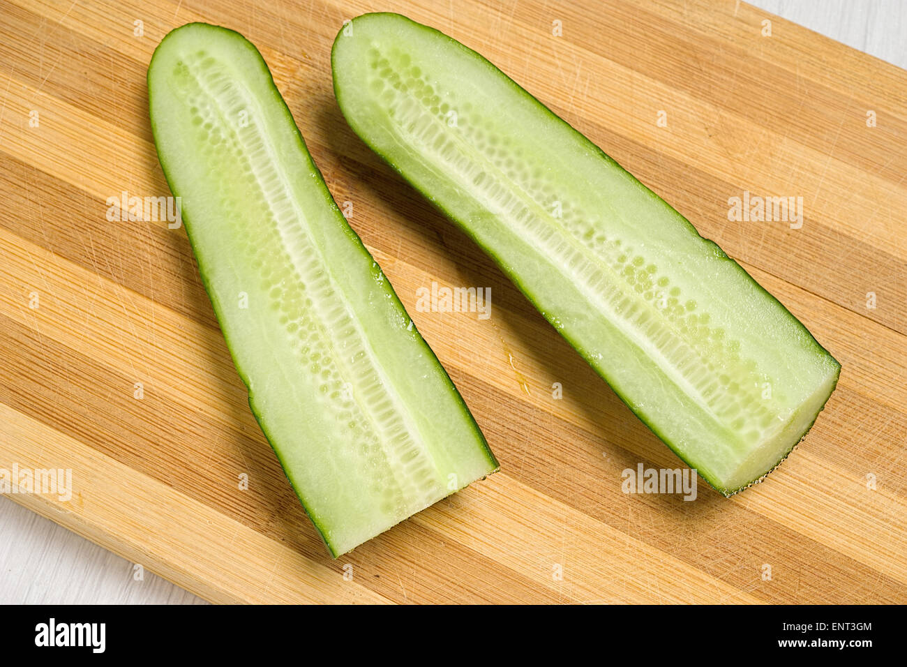 Woman cutting cucumber on wooden hi-res stock photography and images ...