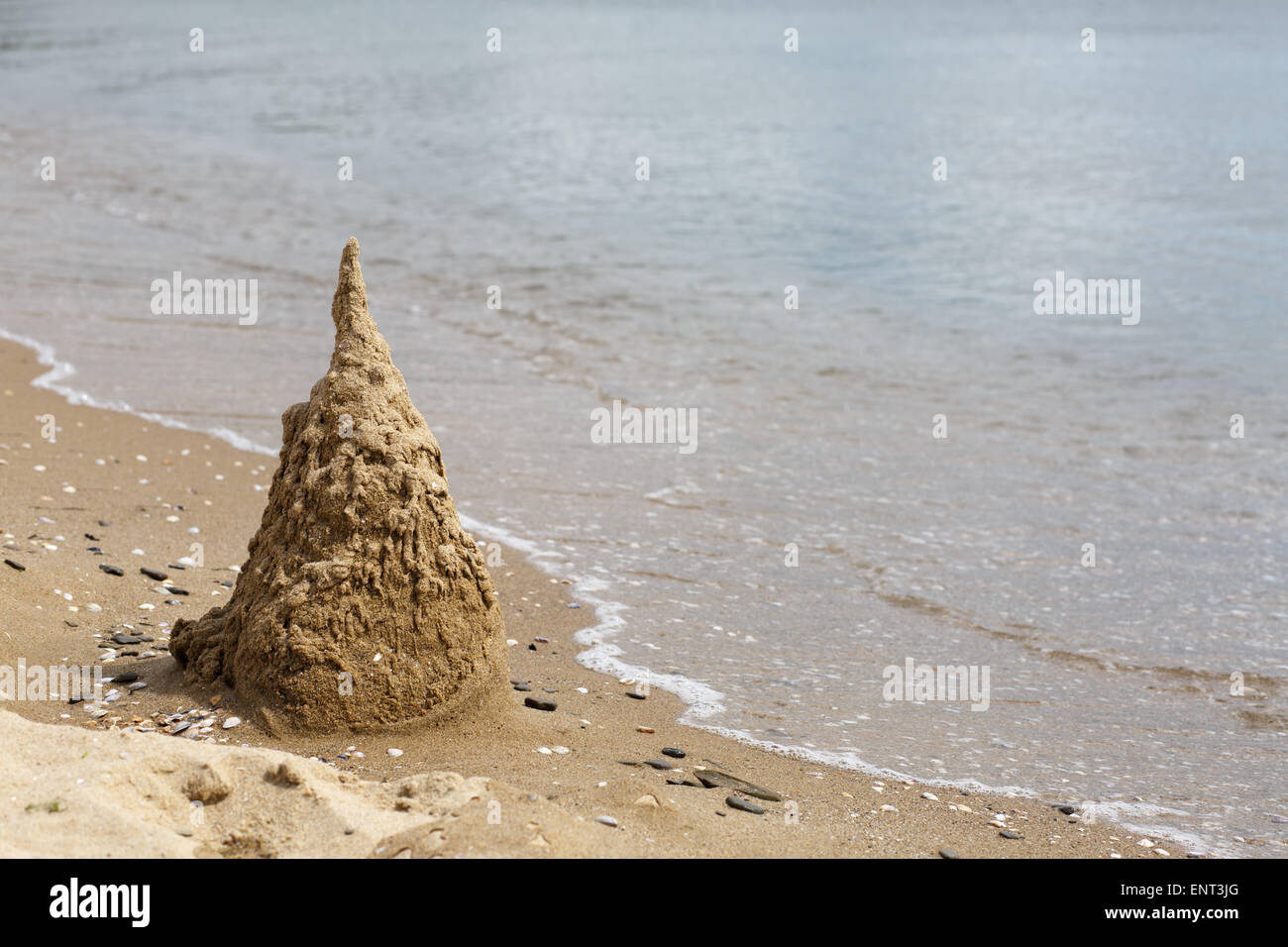 Sand castle, destroyed by the surf. Black Sea coast. Space for text ...