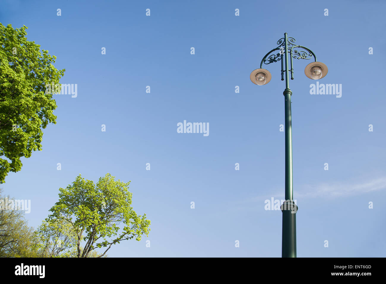 Mast lighting the city streets on a background of blue sky Stock Photo ...