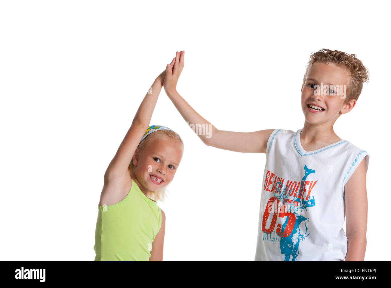 Portrait of blond sister and brother being friends and clapping hands ...