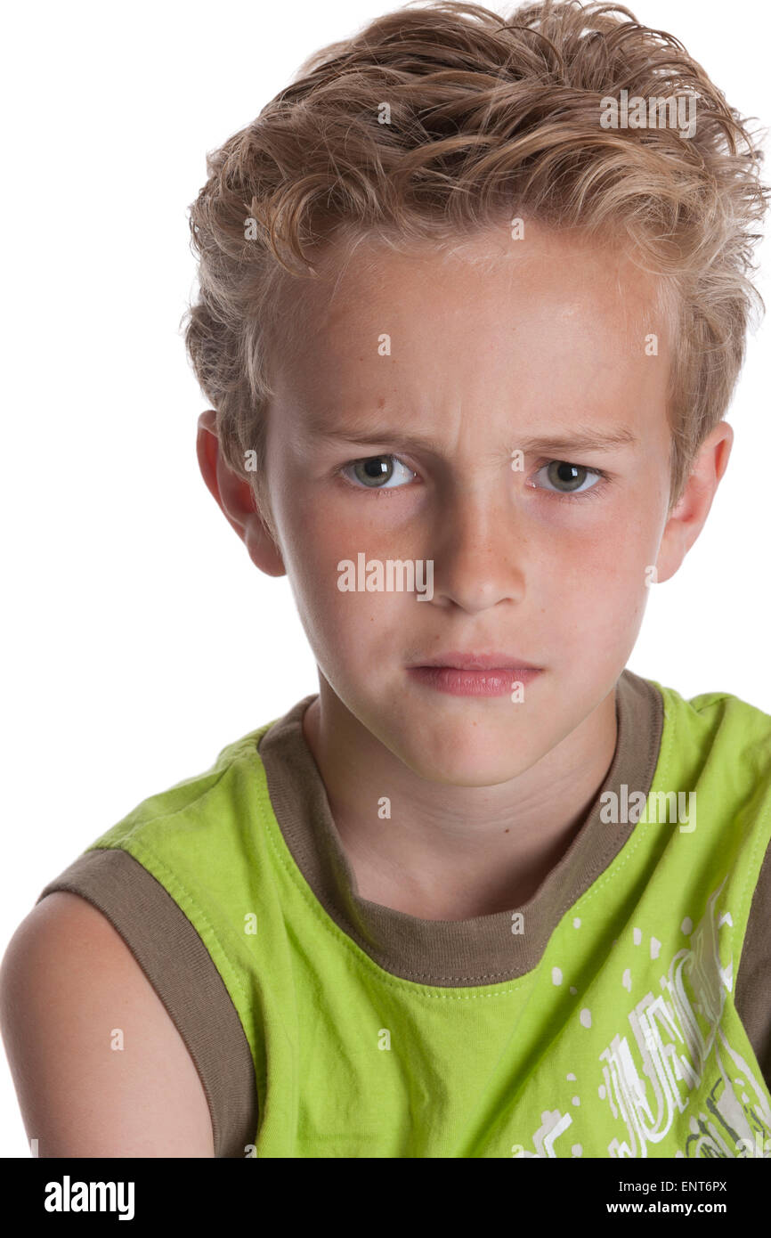 Portrait of an angry blond boy on white background Stock Photo - Alamy