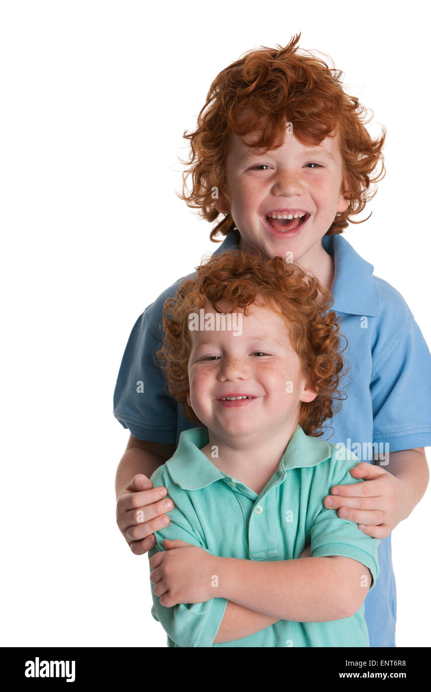 Portrait of two red haired brothers on white background with space for ...