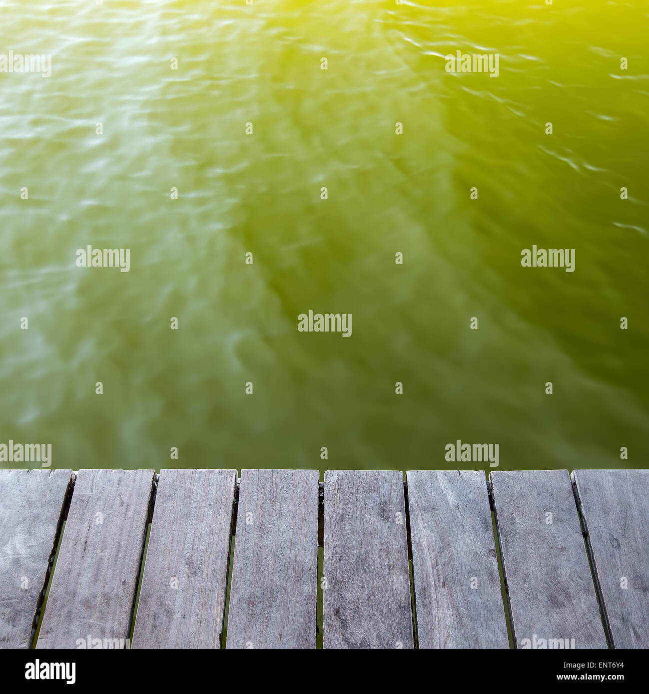 Empty wooden pier with ripple of lagoon water Stock Photo - Alamy