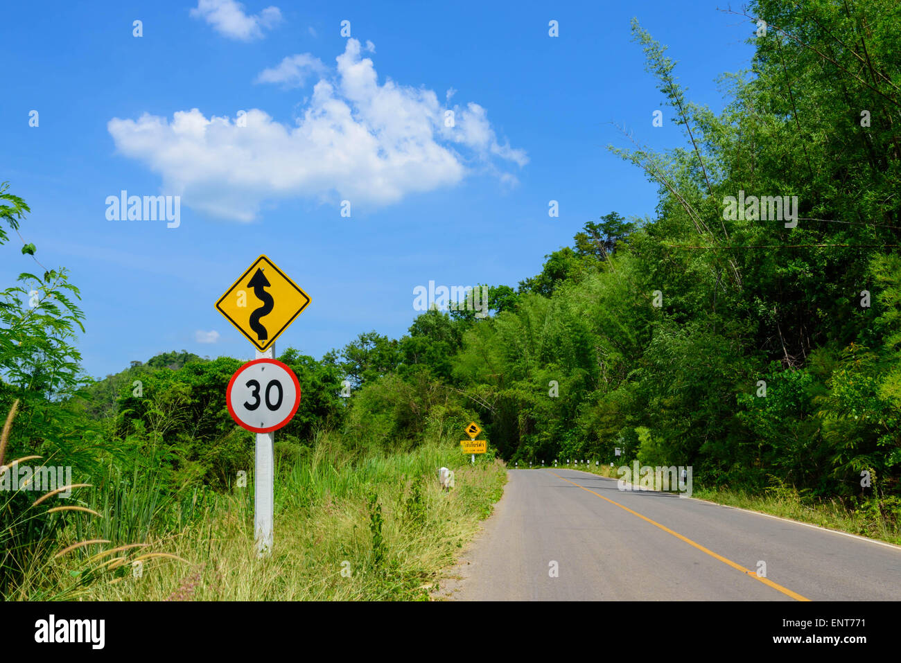 Traffic signs The route runs through beautifully Stock Photo - Alamy