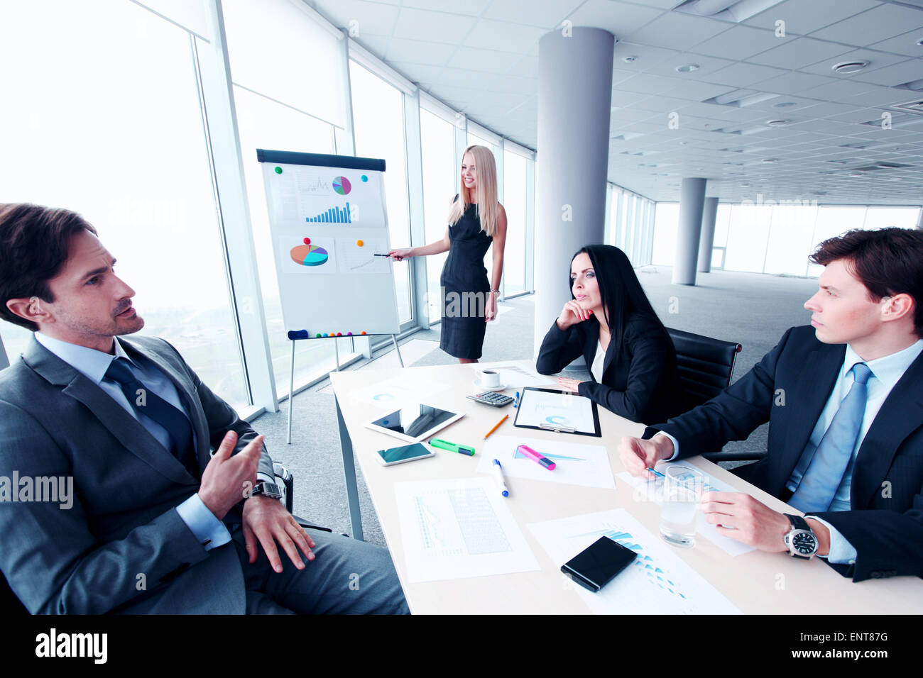 businesswoman showing data on whiteboard Stock Photo - Alamy
