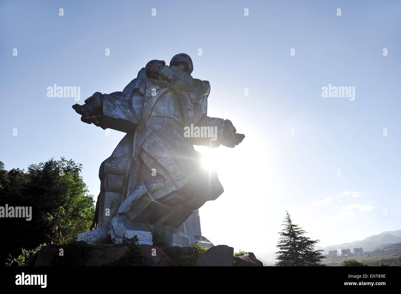 Huge soviet silver statue of a soldier holding a dying comrade ...