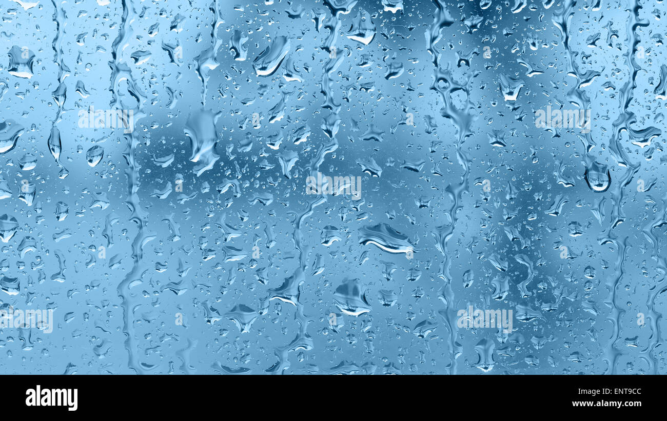 Raindrops on the window, abstract background. Blue tone Stock Photo - Alamy