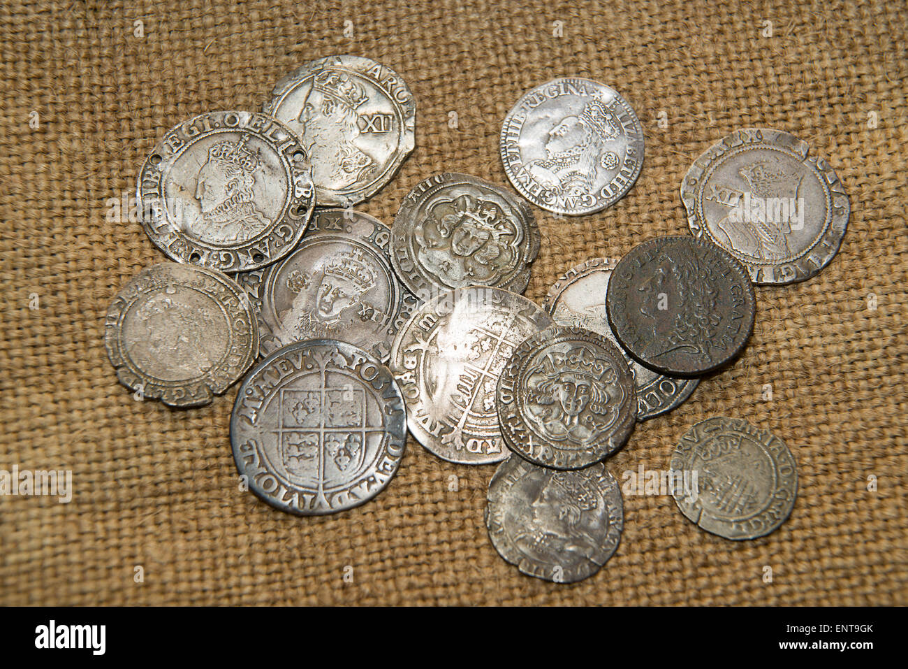 A lot of old England silver coins with portraits of kings on the old ...