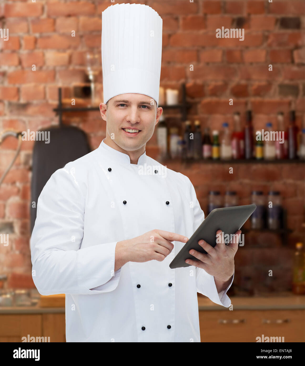 happy male chef cook holding tablet pc Stock Photo - Alamy