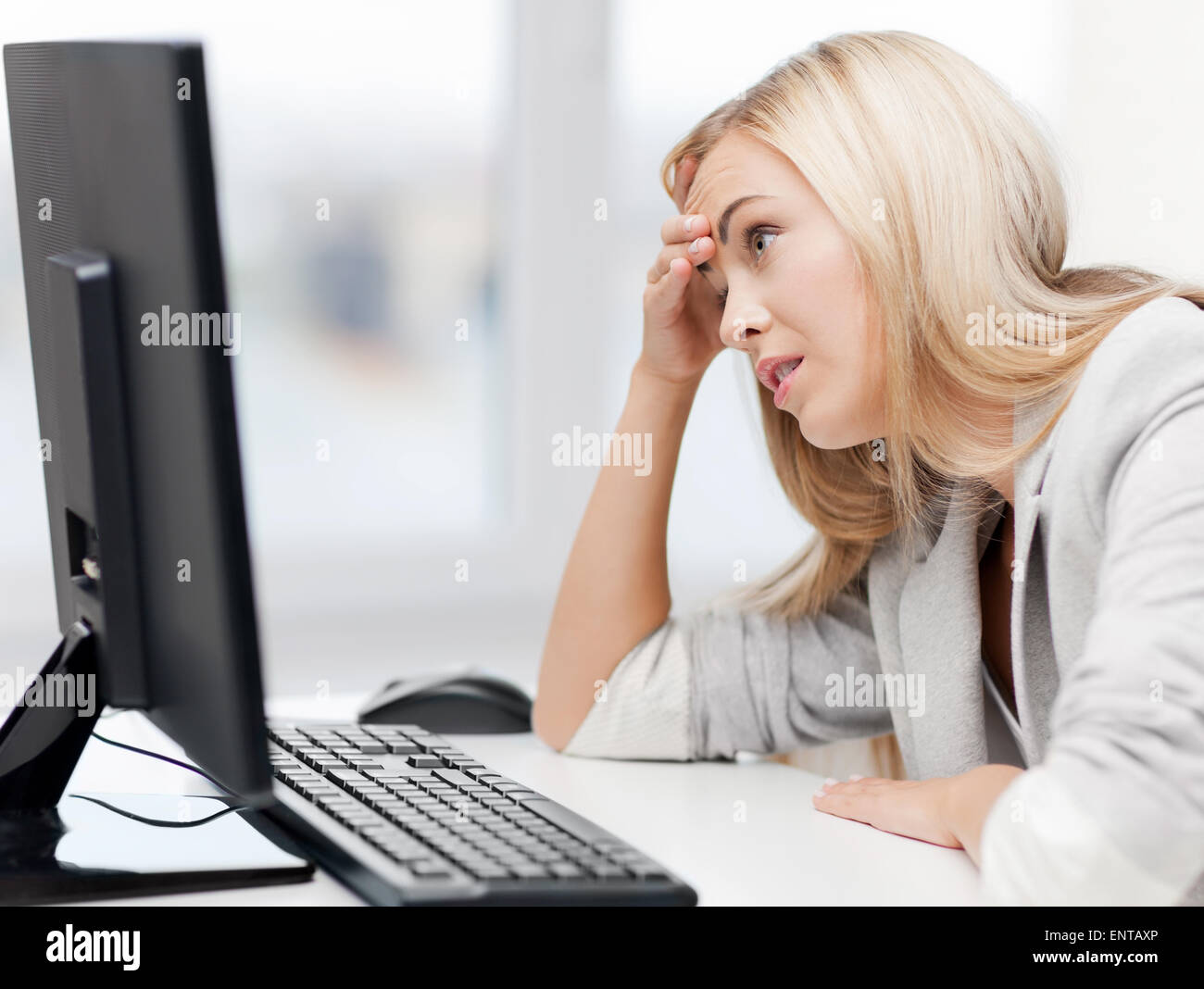 stressed woman with computer Stock Photo - Alamy