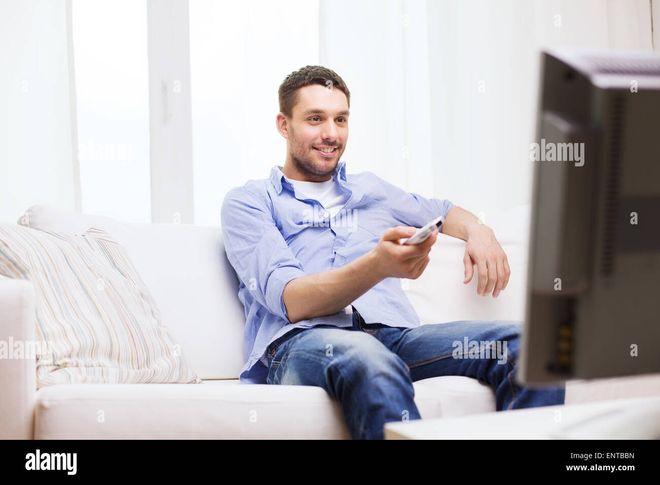 Man with remote control hi-res stock photography and images - Alamy