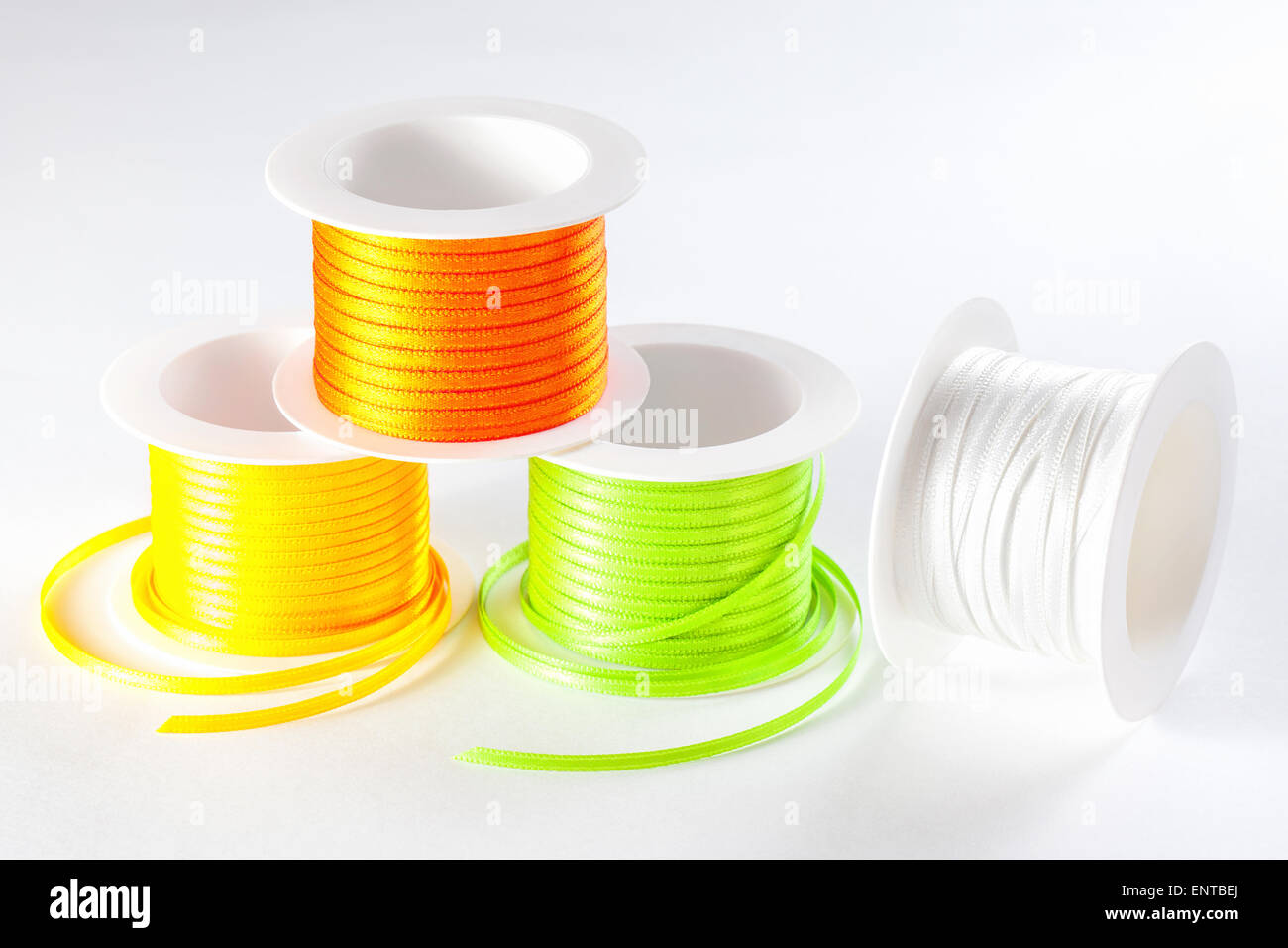 spools of ribbon on white background Stock Photo - Alamy