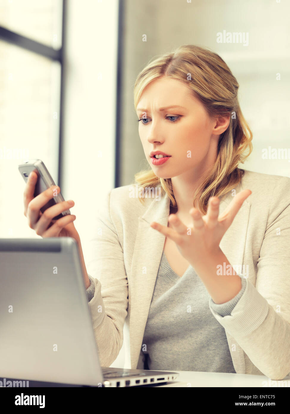 confused woman with cell phone Stock Photo - Alamy