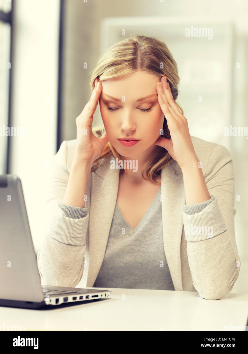 tired woman with laptop computer Stock Photo - Alamy