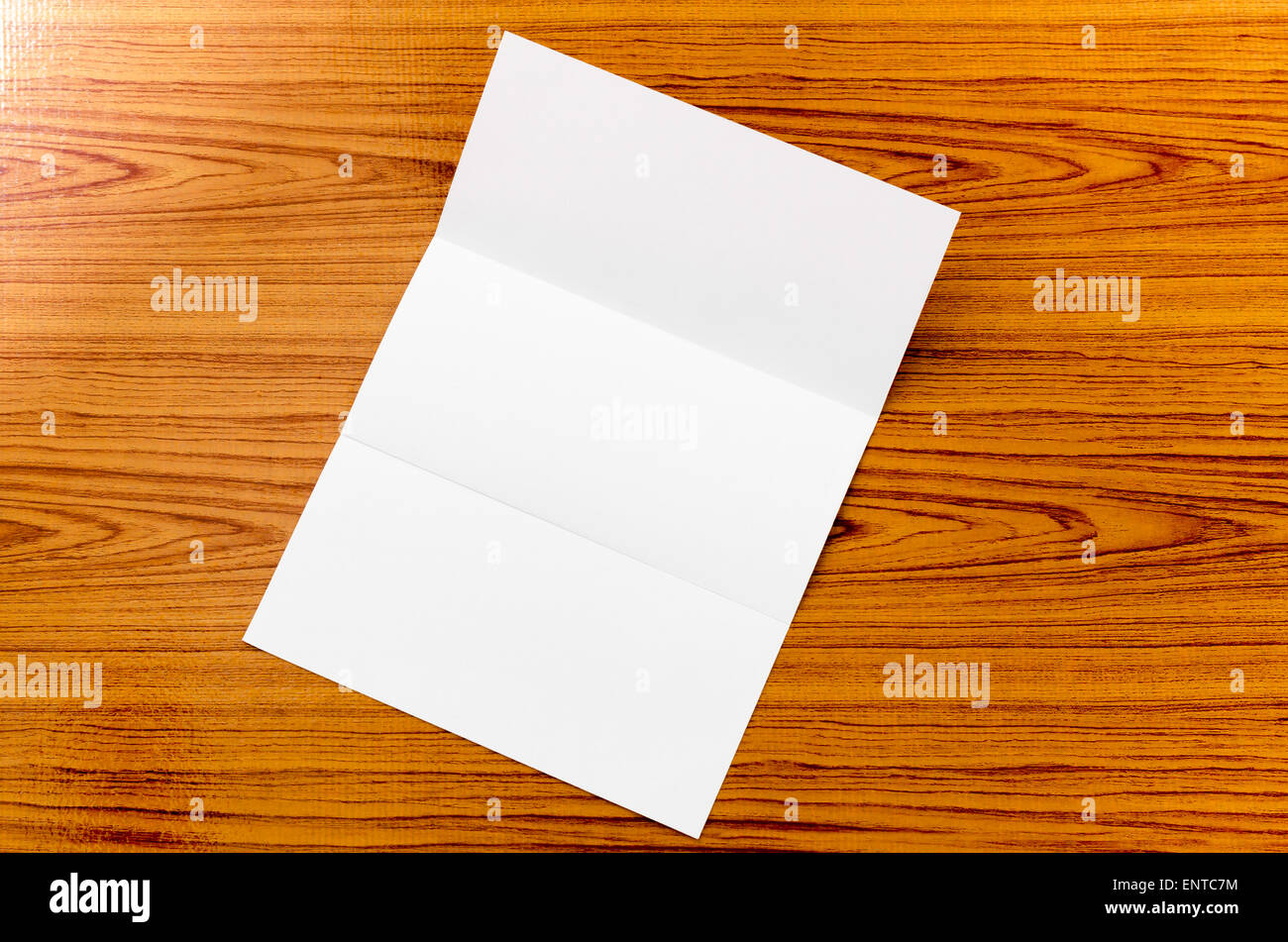 paper on wood background Stock Photo - Alamy