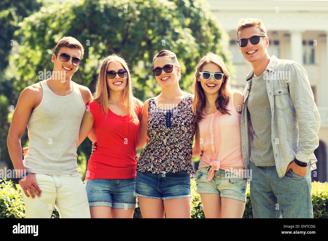 group of smiling friends outdoors Stock Photo - Alamy