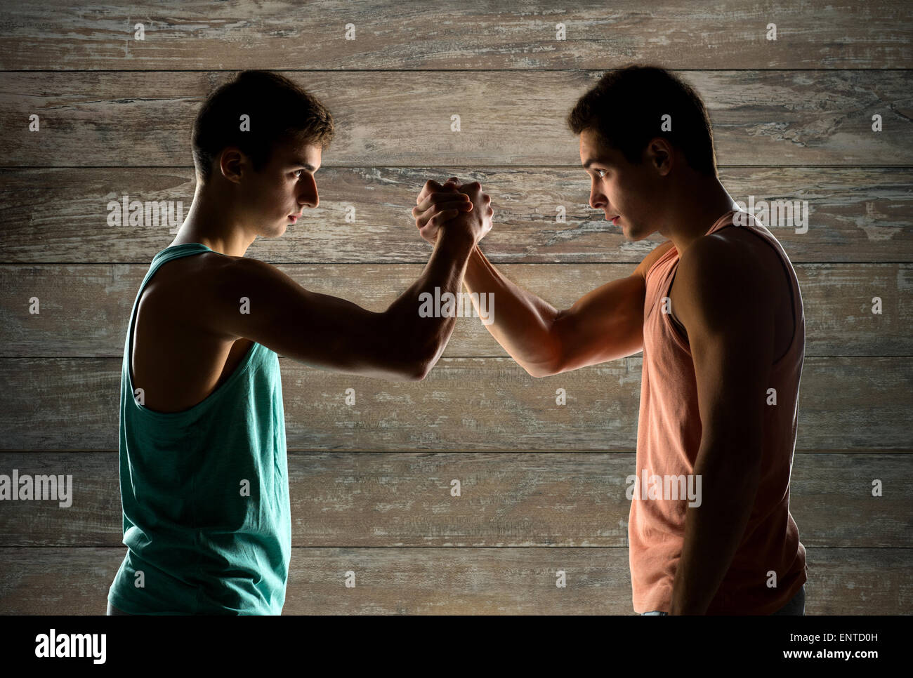 two young men arm wrestling Stock Photo - Alamy