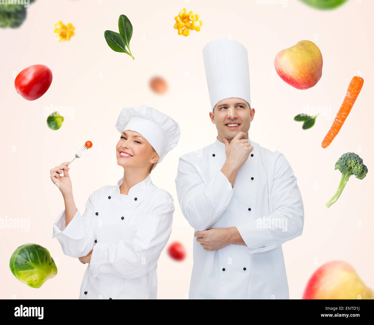 happy chef couple or cooks over food background Stock Photo - Alamy