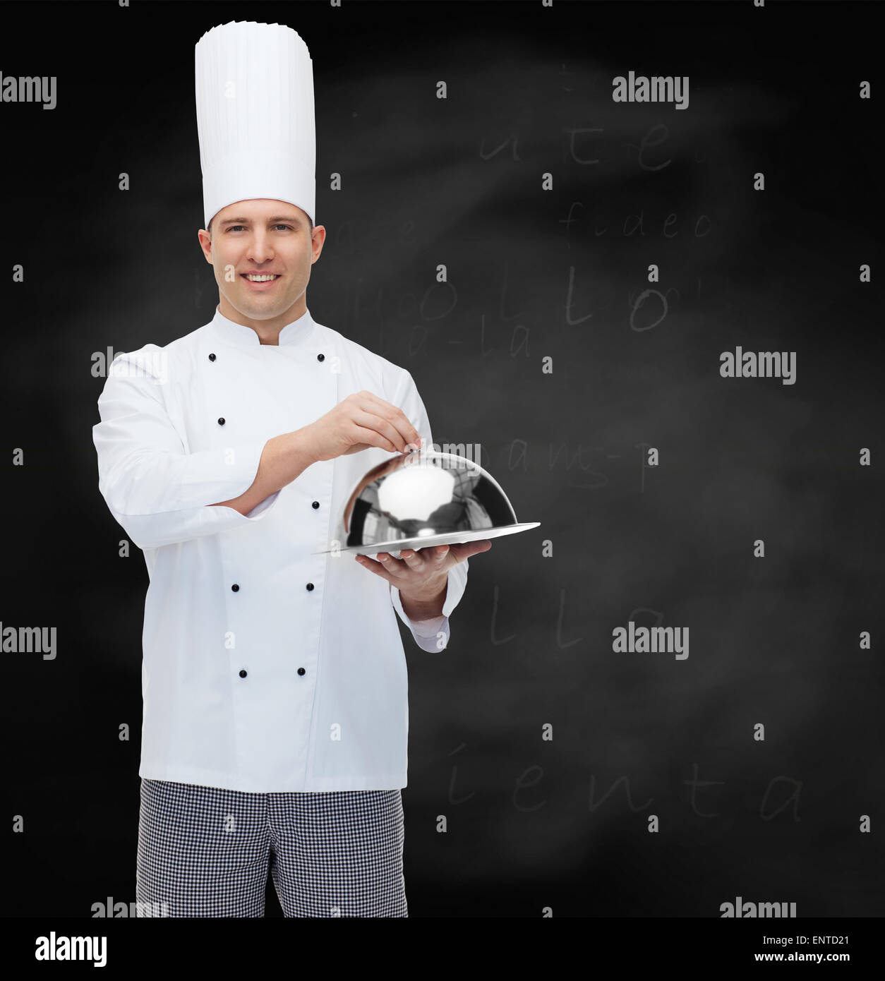 happy male chef cook holding cloche Stock Photo - Alamy