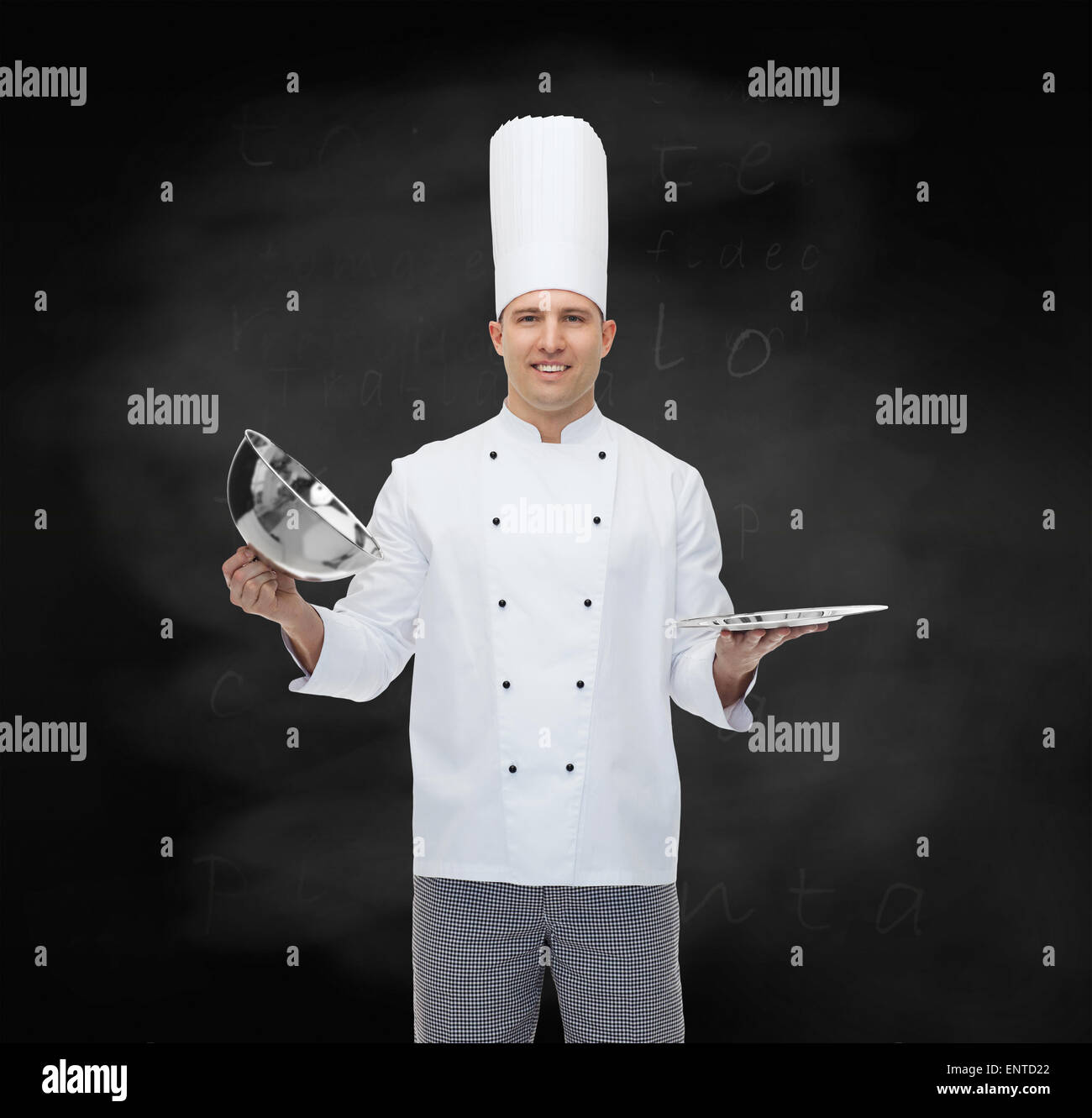 happy male chef cook opening cloche Stock Photo - Alamy