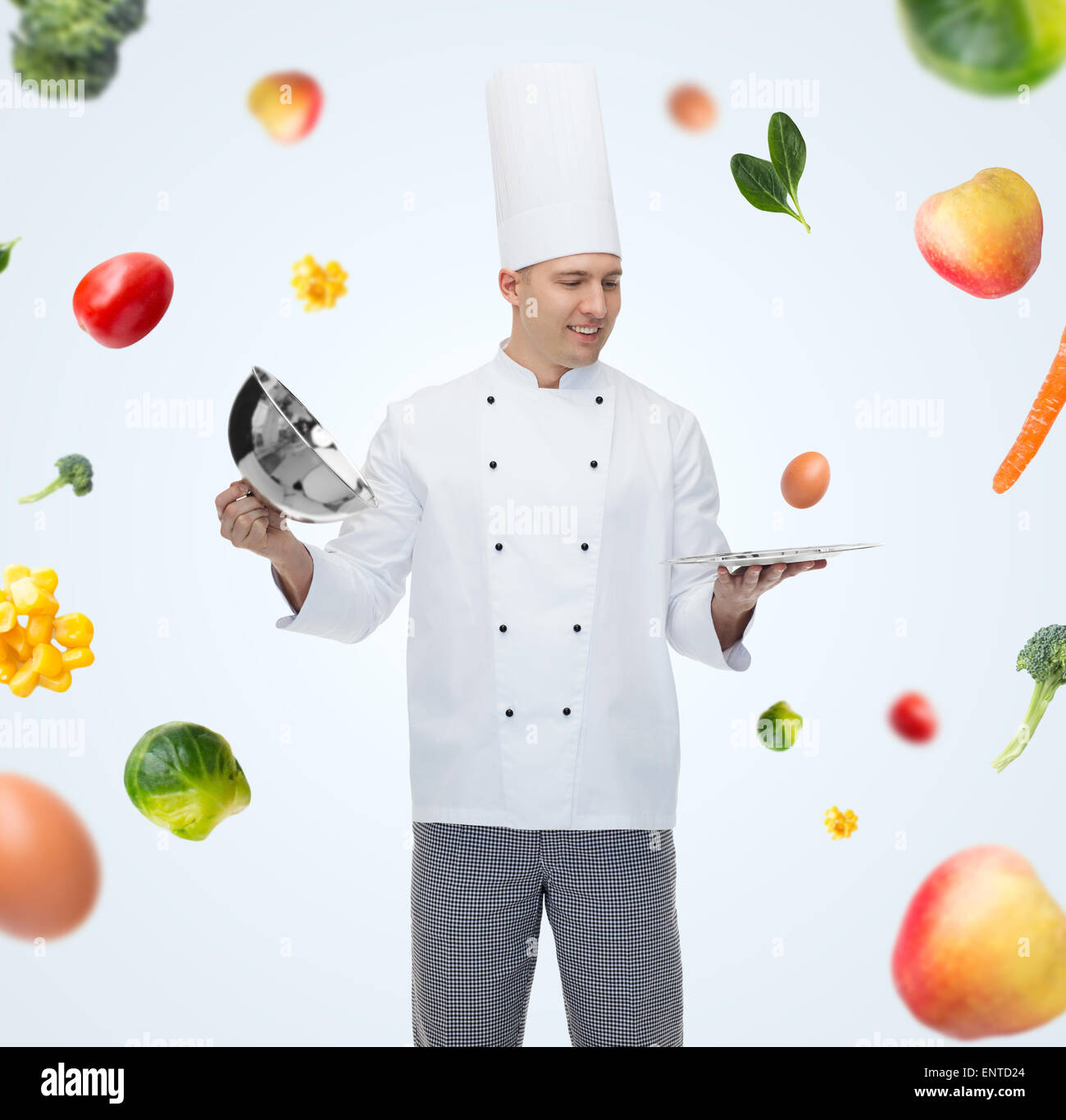 happy male chef cook opening cloche Stock Photo - Alamy
