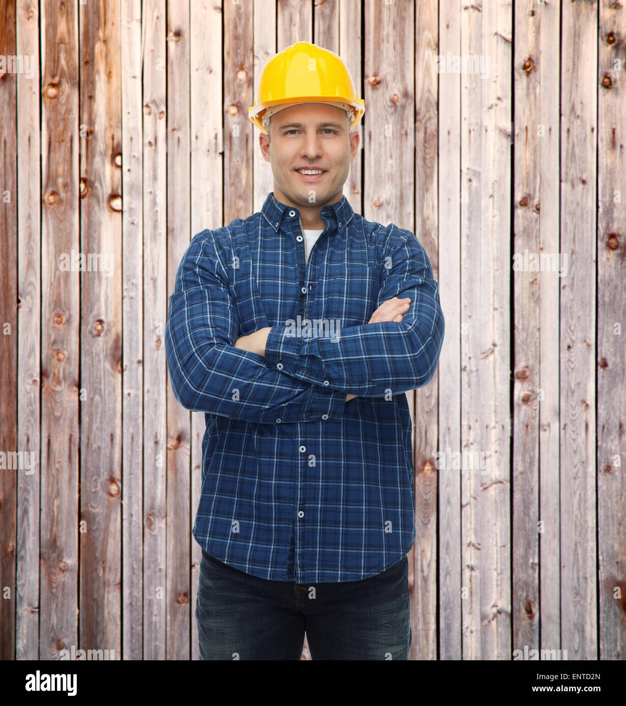 smiling male builder or manual worker in helmet Stock Photo - Alamy