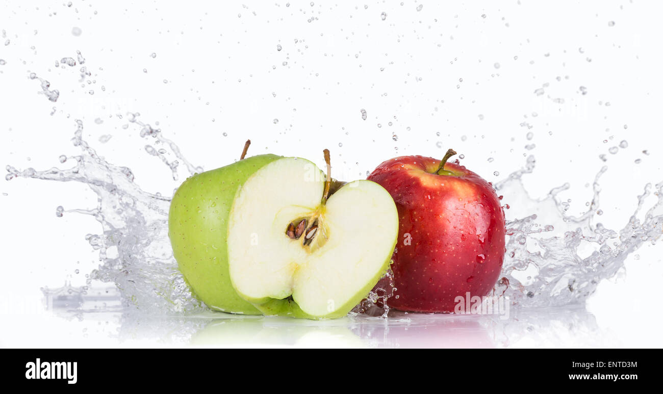 Fresh apples with water splash over white background Stock Photo - Alamy