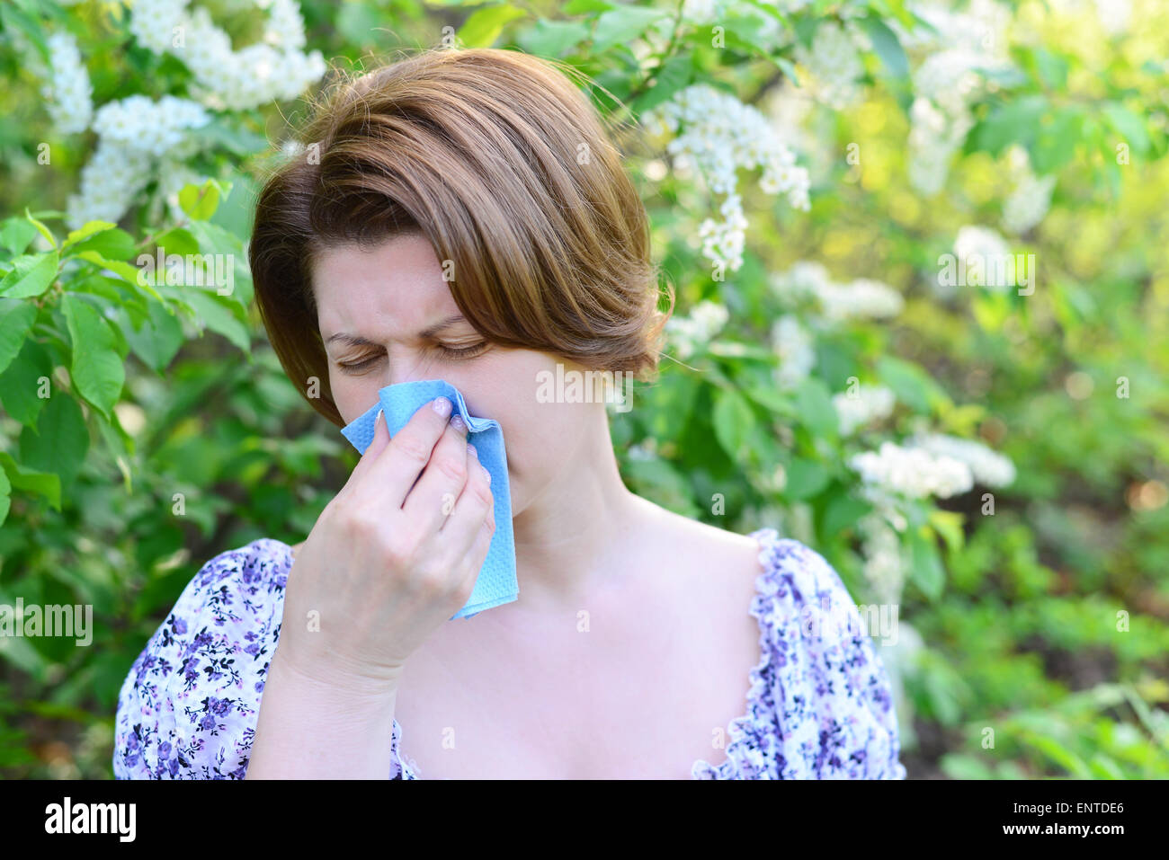adult female with allergic rhinitis about a bird cherry blossoms Stock ...